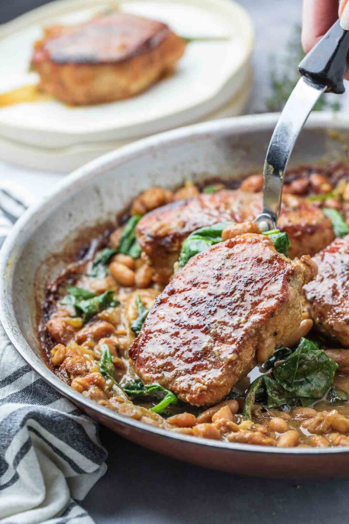 Pork Chop Skillet Dinner with Spinach and White Beans